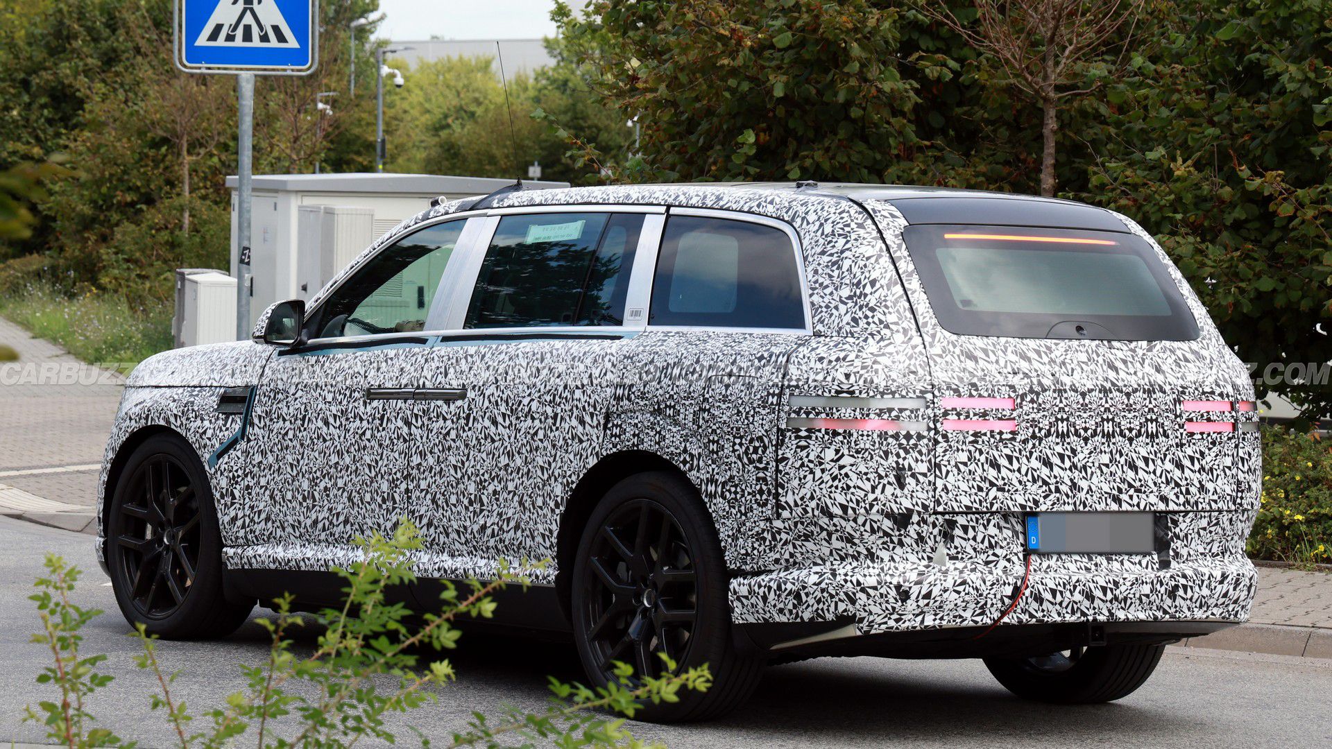 Genesis GV90 Drops Camo, Shows Swanky Doors In New Spy Shots