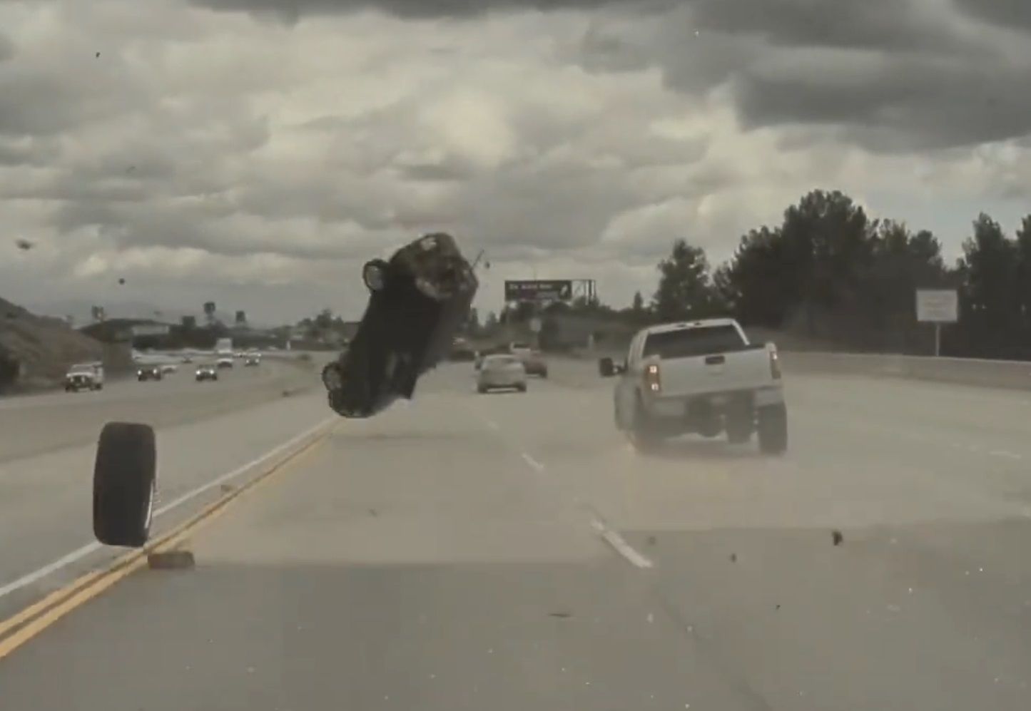 Watch A Rogue Truck Tire Blast A Kia Soul 15 Feet Into The Air On The ...