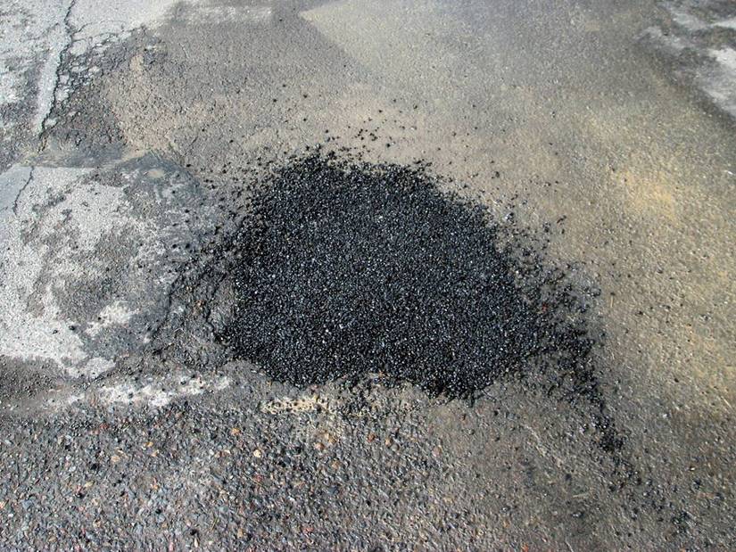 Anarchists Are Fixing Potholes In Portland