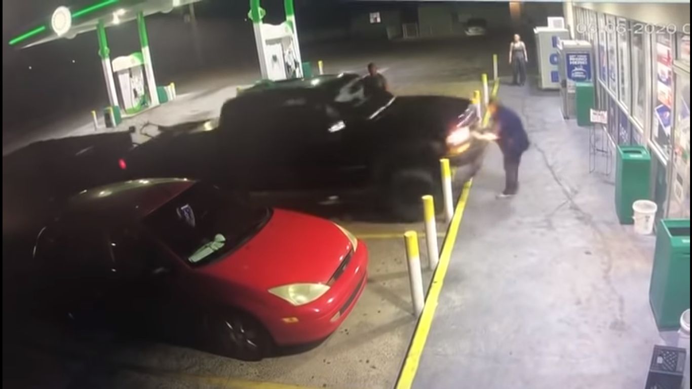 Angry Chevy Silverado Driver Tries To Run Over Gas Station Employee