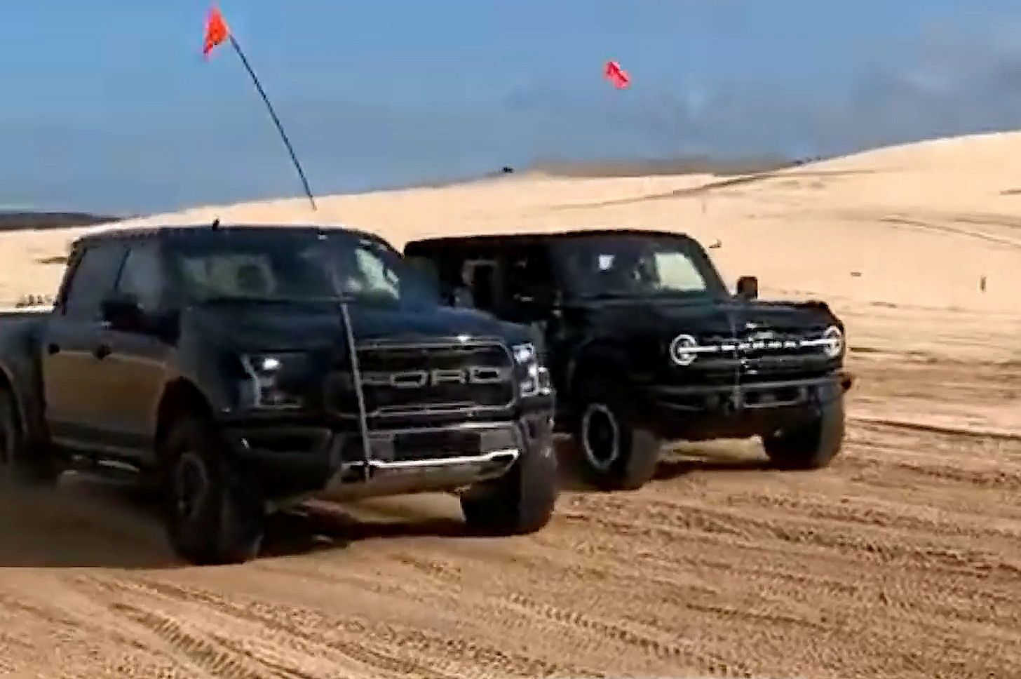 Drag Race: New Ford Bronco Vs. F-150 Raptor In The Sand
